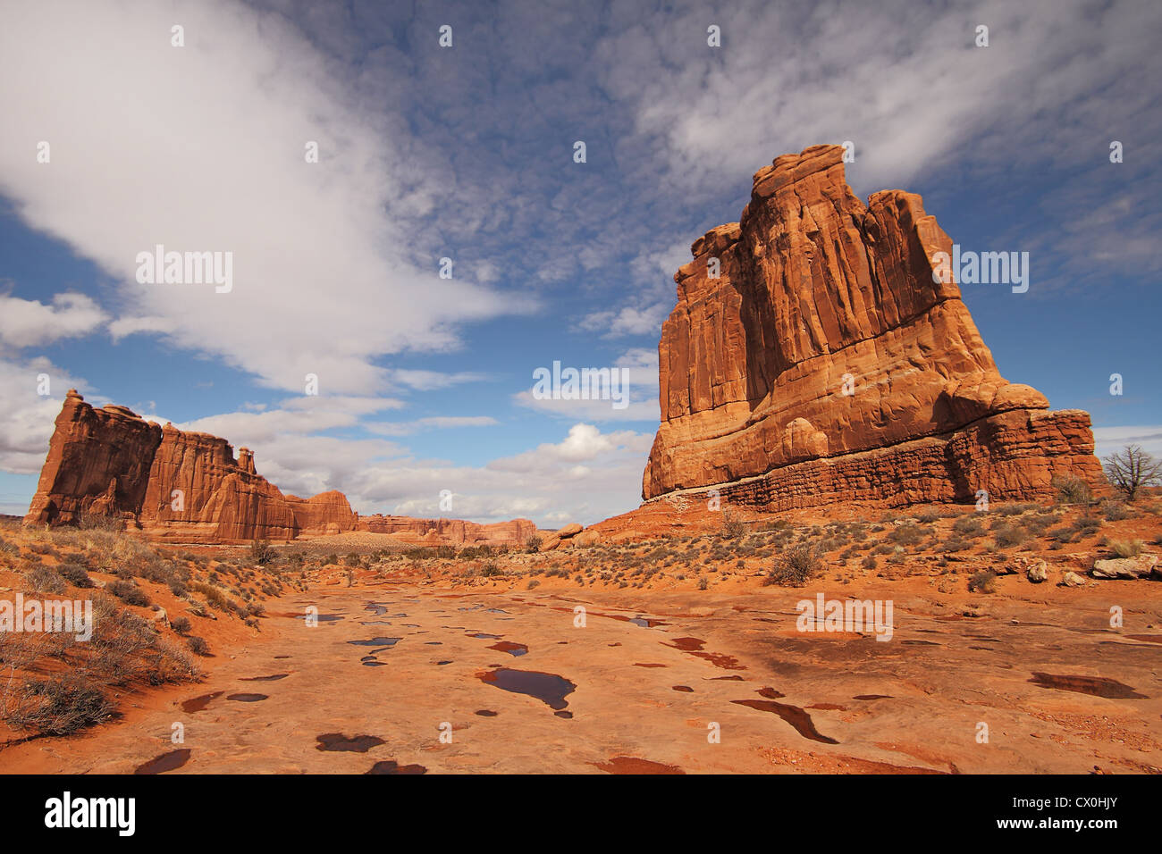 Sandstone monuments along the Park Avenue train in Arches National Park ...