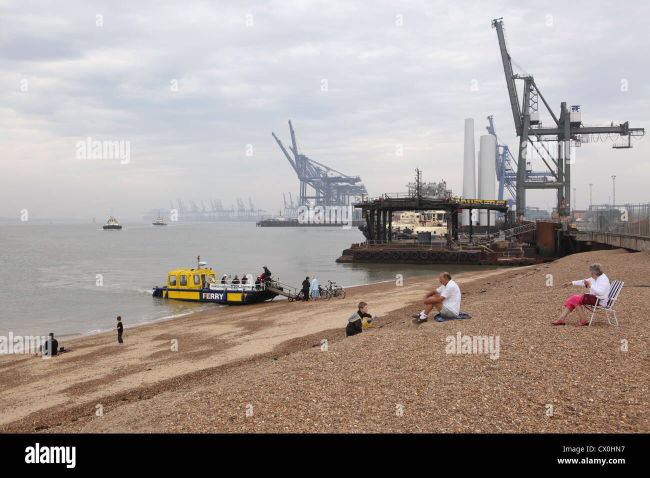 Beach at Languard Fort, with cranes at Trinity Dock Quay in the ...