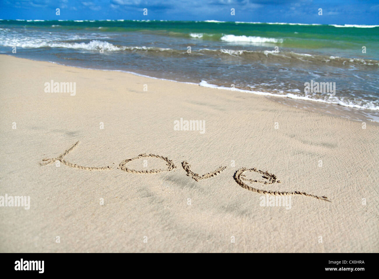 Sign Love on sand on caribbean beach, Dominican Republic Stock Photo ...