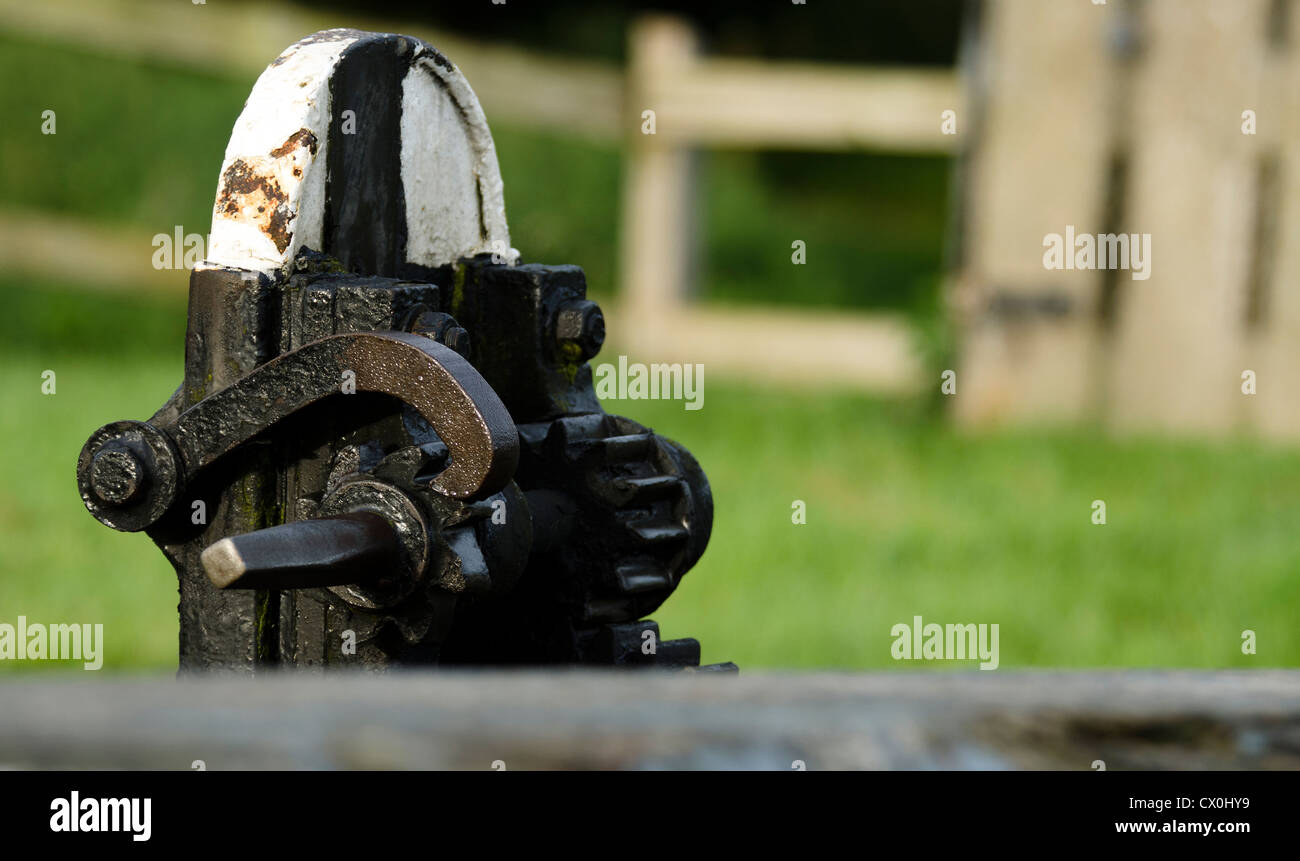 English canals ground paddle seen over lock gate beam arm. Used to fill ...