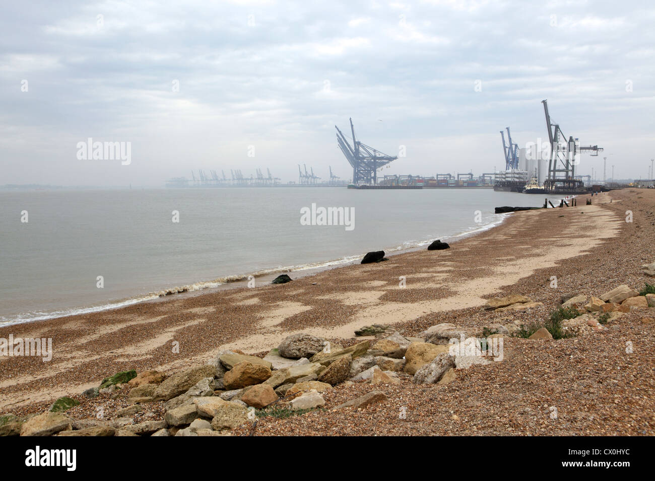 Beach at Languard Fort, with cranes at Trinity Dock Quay in the ...