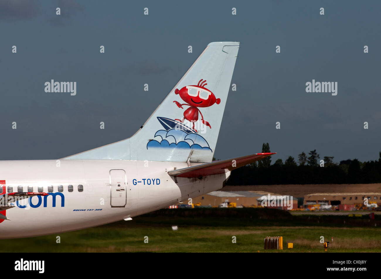 Bmi Baby Boeing 737 aircraft tail with surfer livery Stock Photo - Alamy