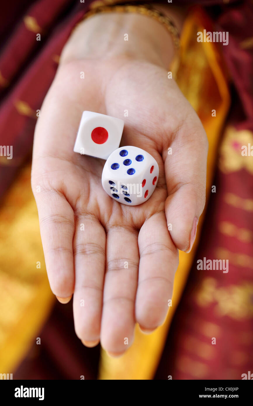 Hand holding pair dice hi-res stock photography and images - Alamy