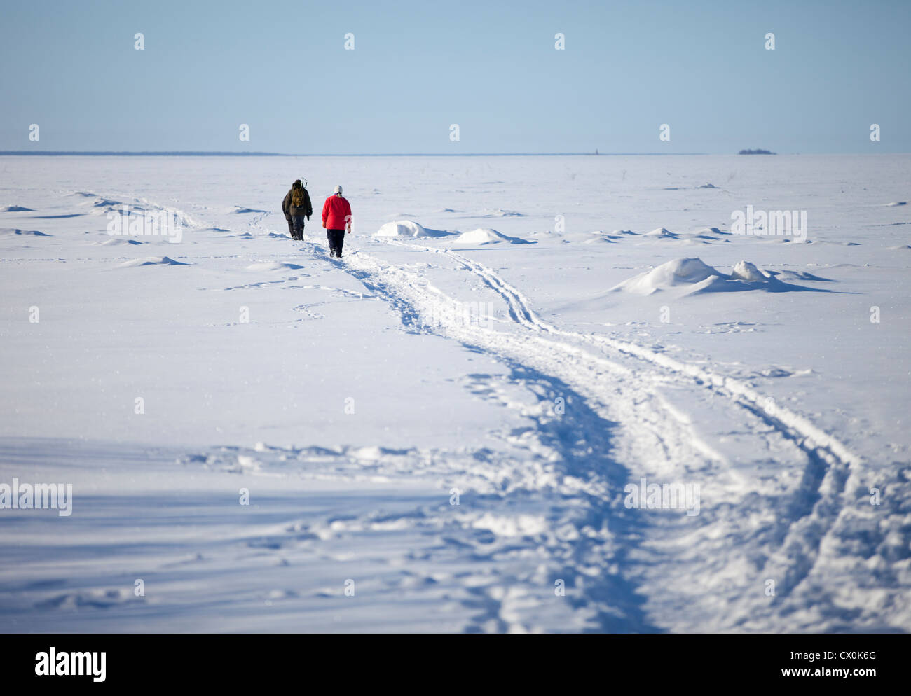 Fishermen walking at sea ice at Gulf of Bothnia , Finland Stock Photo ...