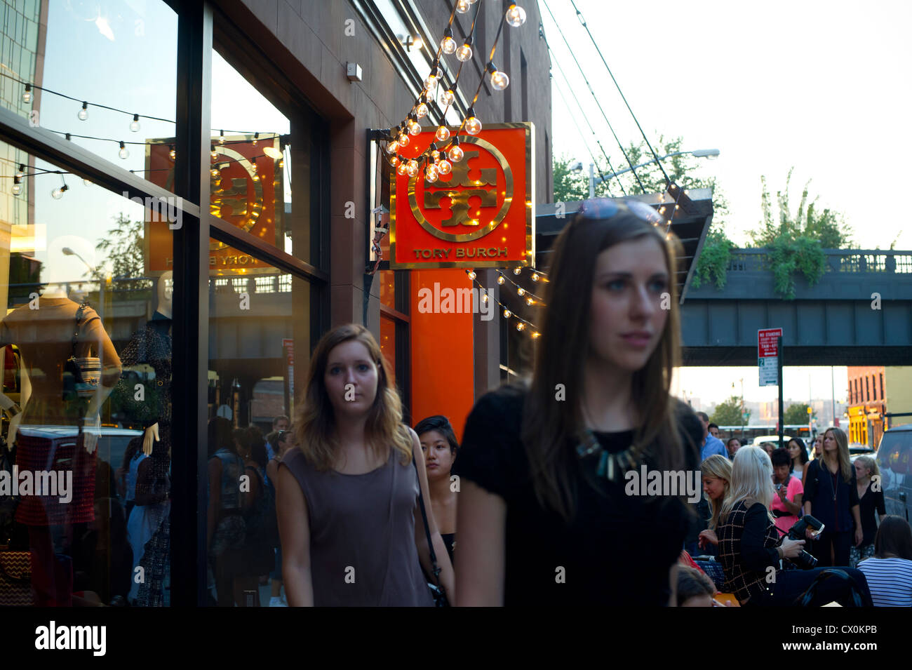 Hordes of shoppers on line outside the Tory Burch store in the trendy ...