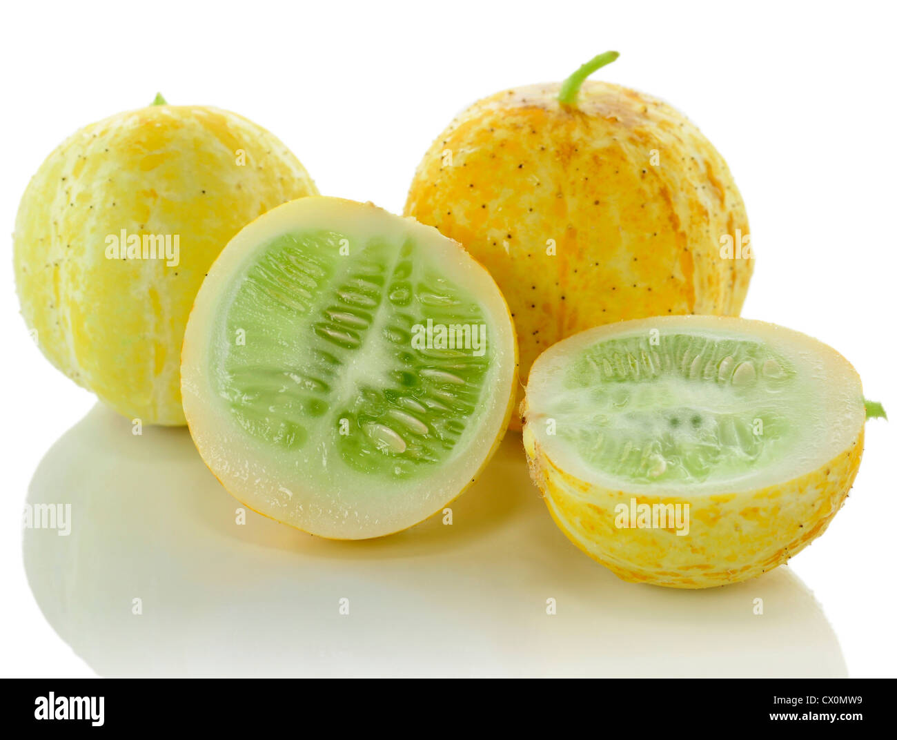 yellow cucumbers on white background Stock Photo - Alamy