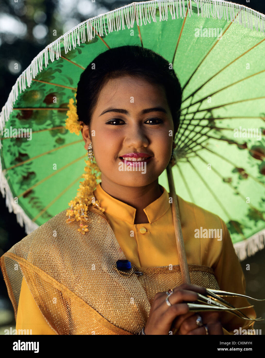Asia. Thailand. Outdoor portrait of woman in traditional costume ...