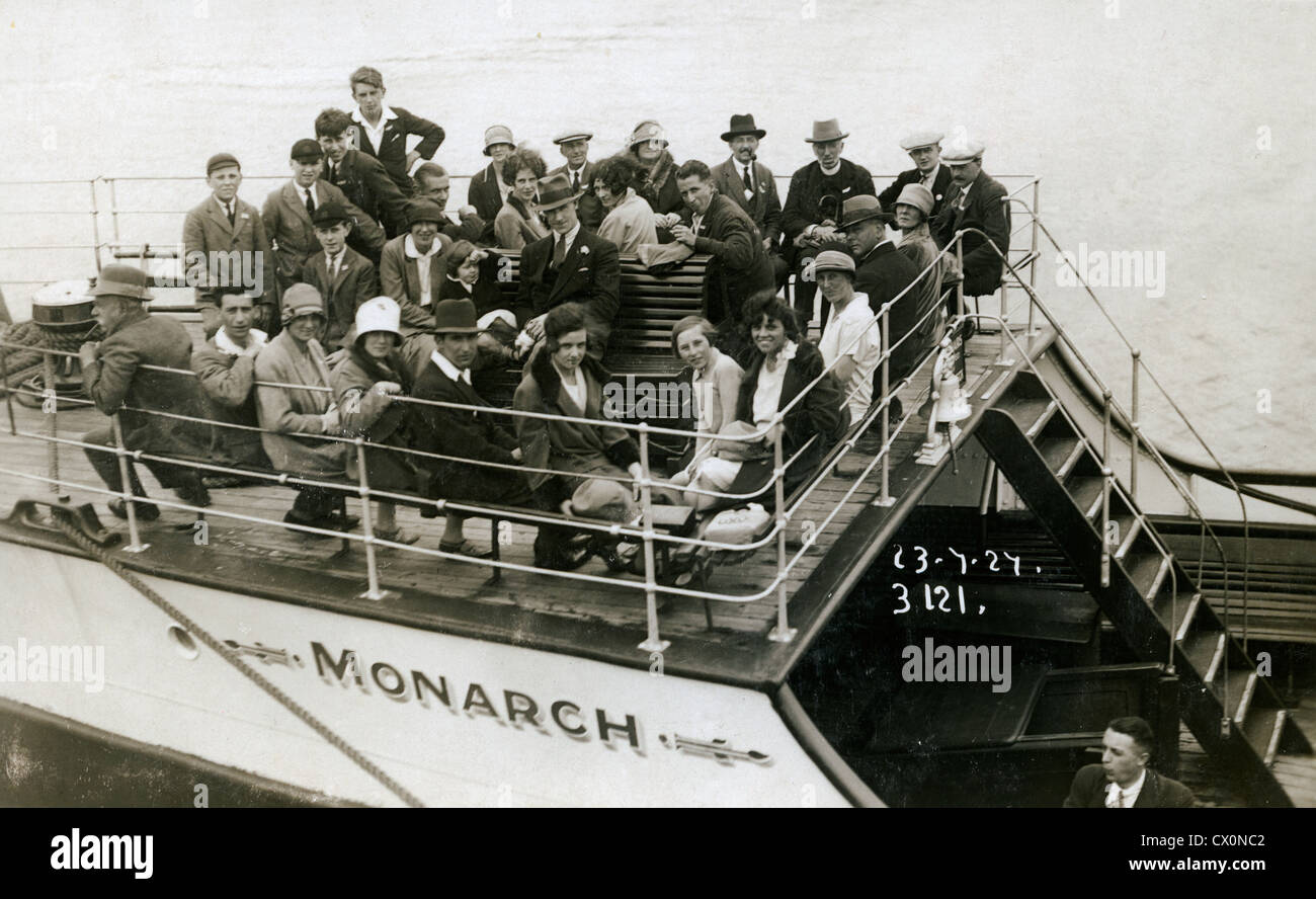 A group of friends and family on a boat trip on the English riviera in ...