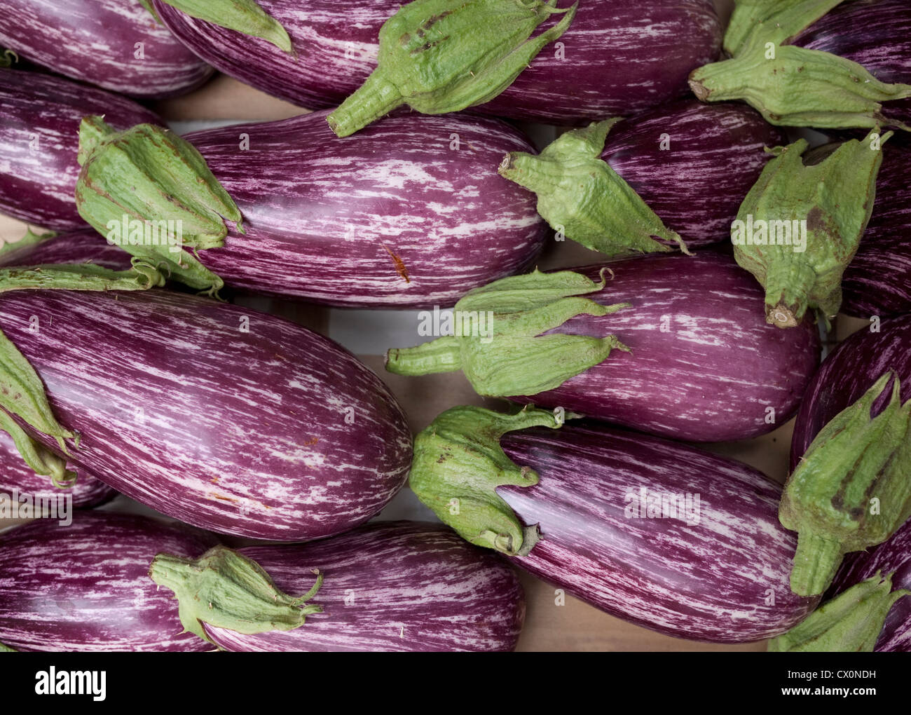 Purple Aubergine fruit on french market stall Stock Photo - Alamy