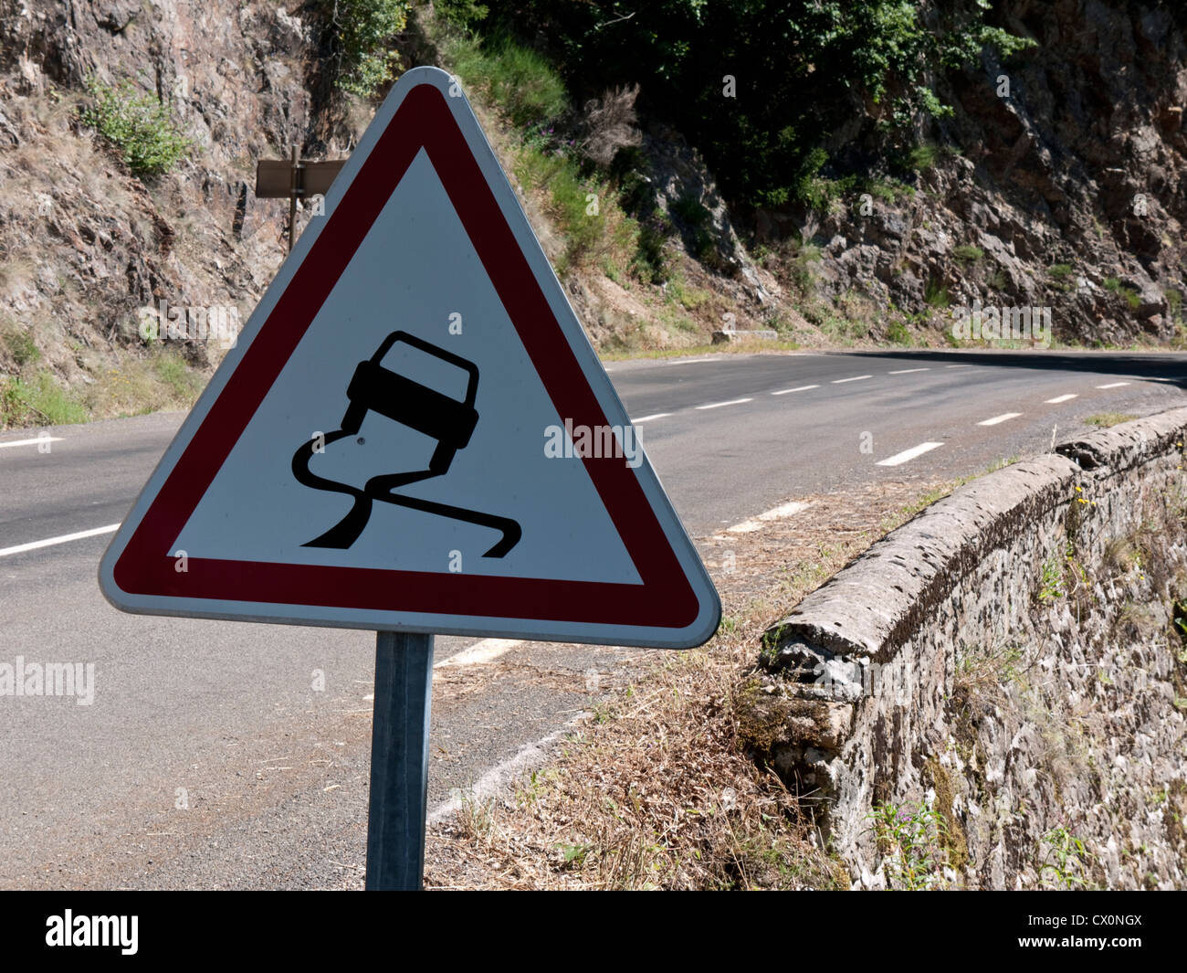 Sharp bend road sign hi-res stock photography and images - Alamy