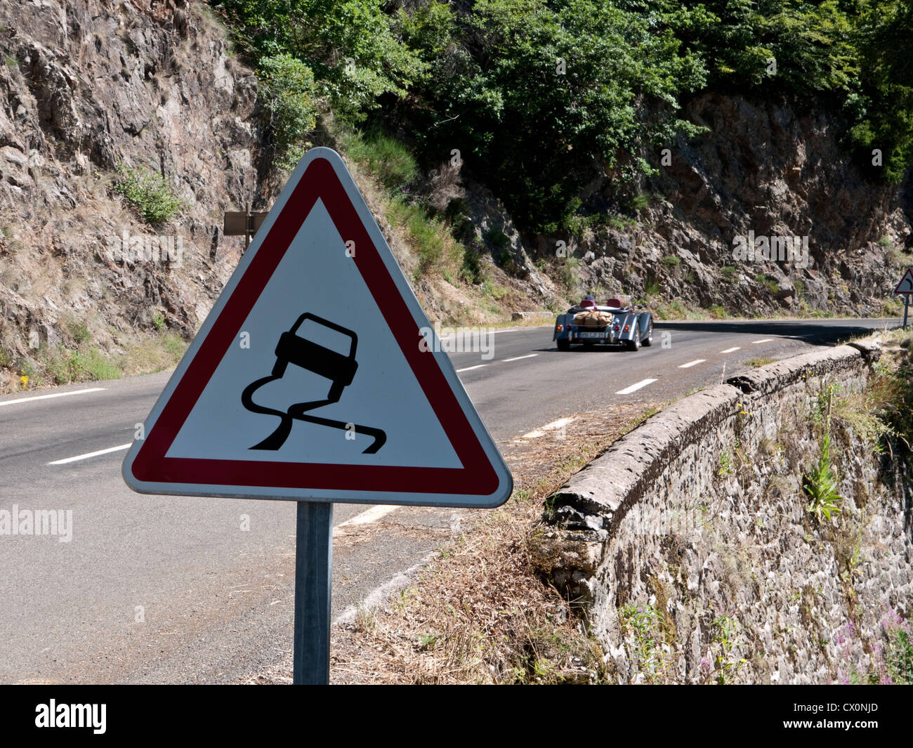 Sharp bend road sign hi-res stock photography and images - Alamy