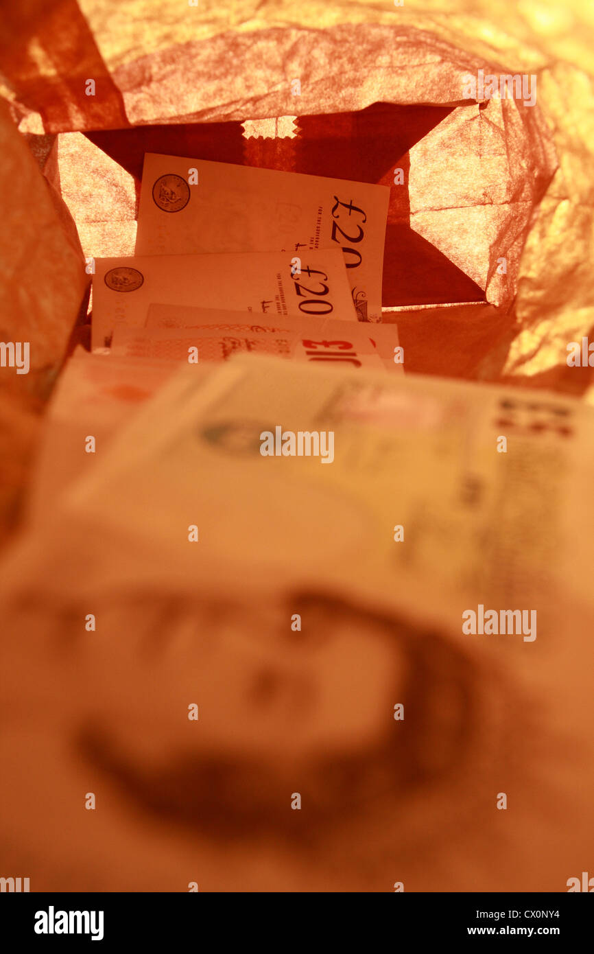 sterling notes in a brown paper bag Stock Photo - Alamy