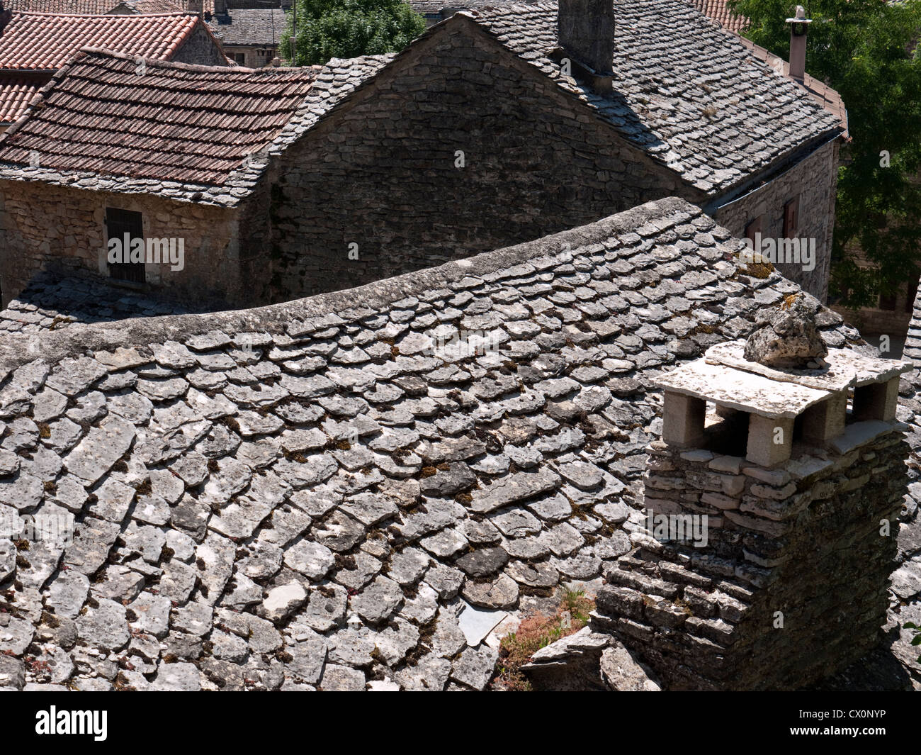 Rooftop stone tiles in Medieval walled town La Couvertoirade, France ...