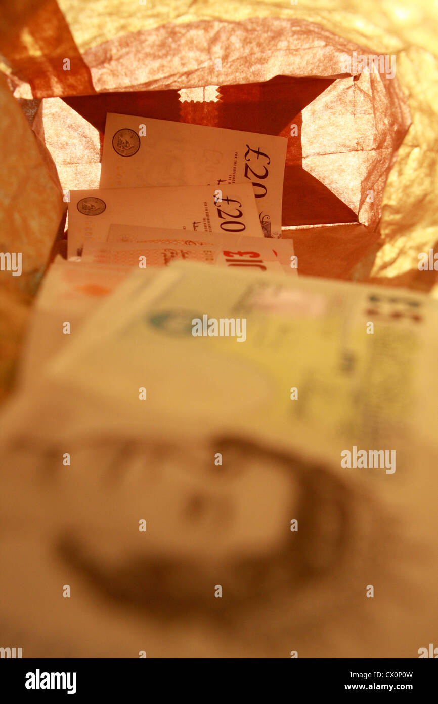 sterling notes in a brown paper bag Stock Photo - Alamy