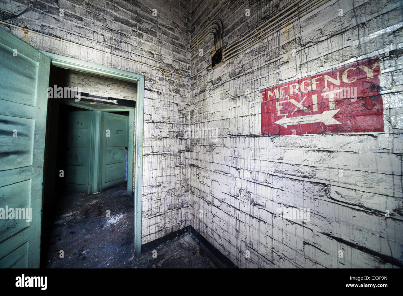 An emergency exit sign and door in a WWII control centre Stock Photo ...