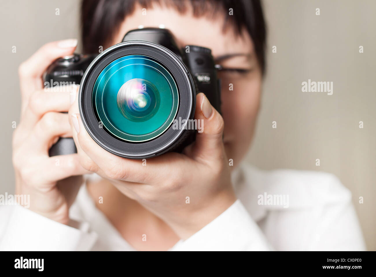 Pretty woman is a professional photographer with dslr camera Stock ...