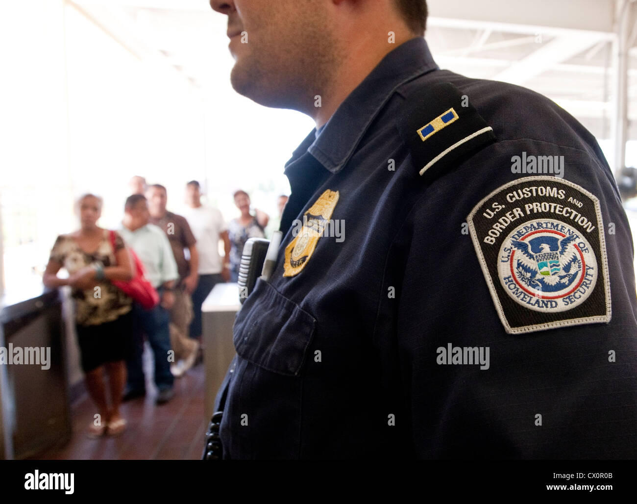 US Customs and Border Protection officers attend to ask for ...