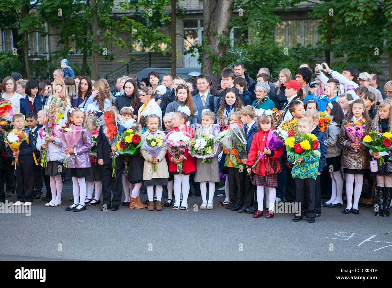 Small Russian children with parents at solemn line before first time ...