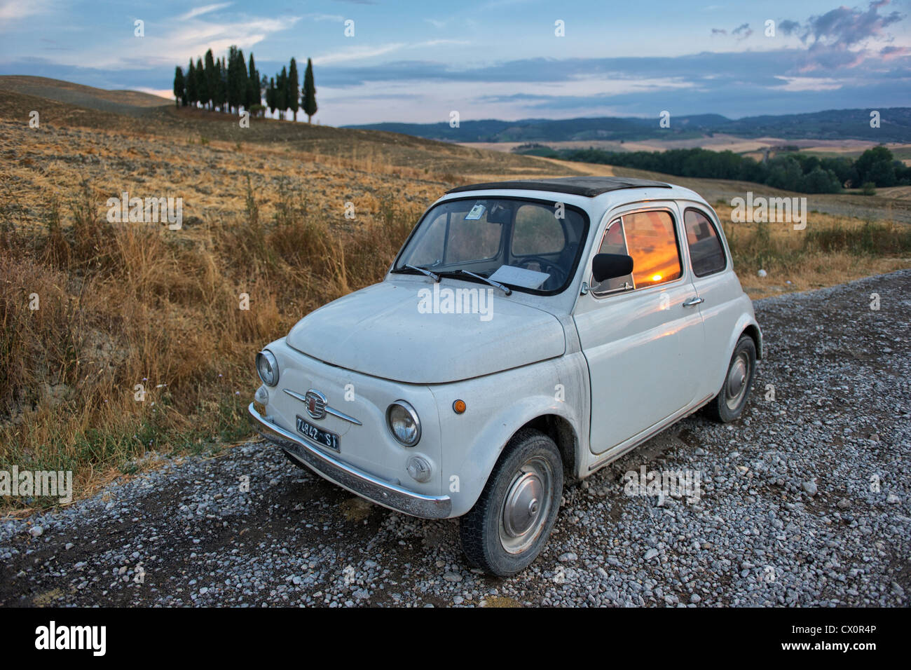 Old car in Tuscan sunset Stock Photo - Alamy