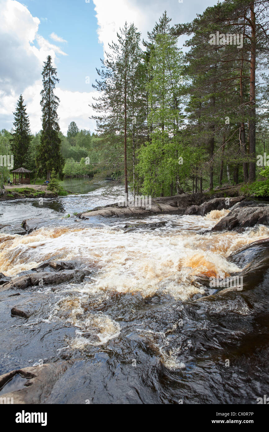 Lowland waterfall in Ruskeala in the Republic of Karelia, Russia. Rapid ...