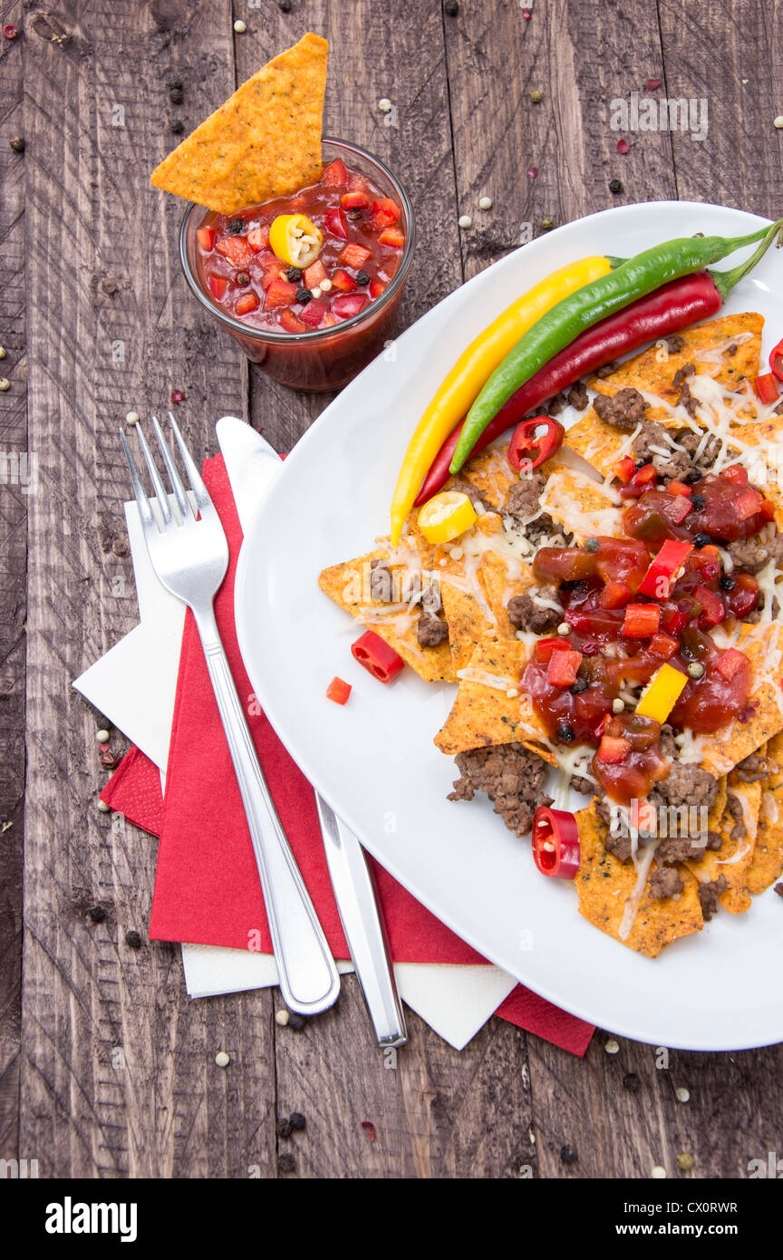 Portion of Nachos on a plate with Meat and Cheese Stock Photo - Alamy