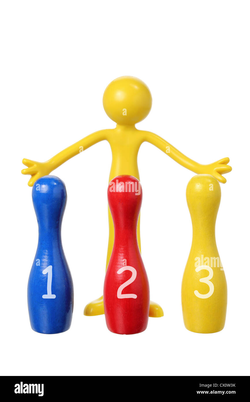 Miniature Rubber Figure with Bowling Pins Stock Photo - Alamy