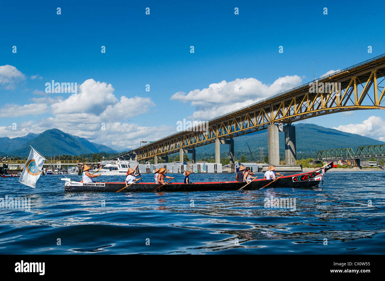 Squamish First Nations canoe approaches Iron Workers Memorial Bridge ...