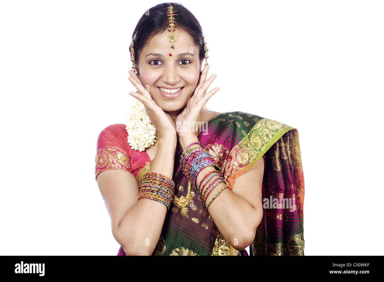 Surprised young traditional Indian woman against white Stock Photo - Alamy