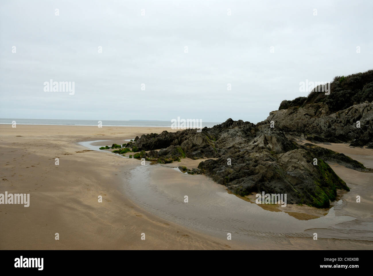 View of the sandy Bay and rocks at Woolacombe North Devon Stock Photo ...
