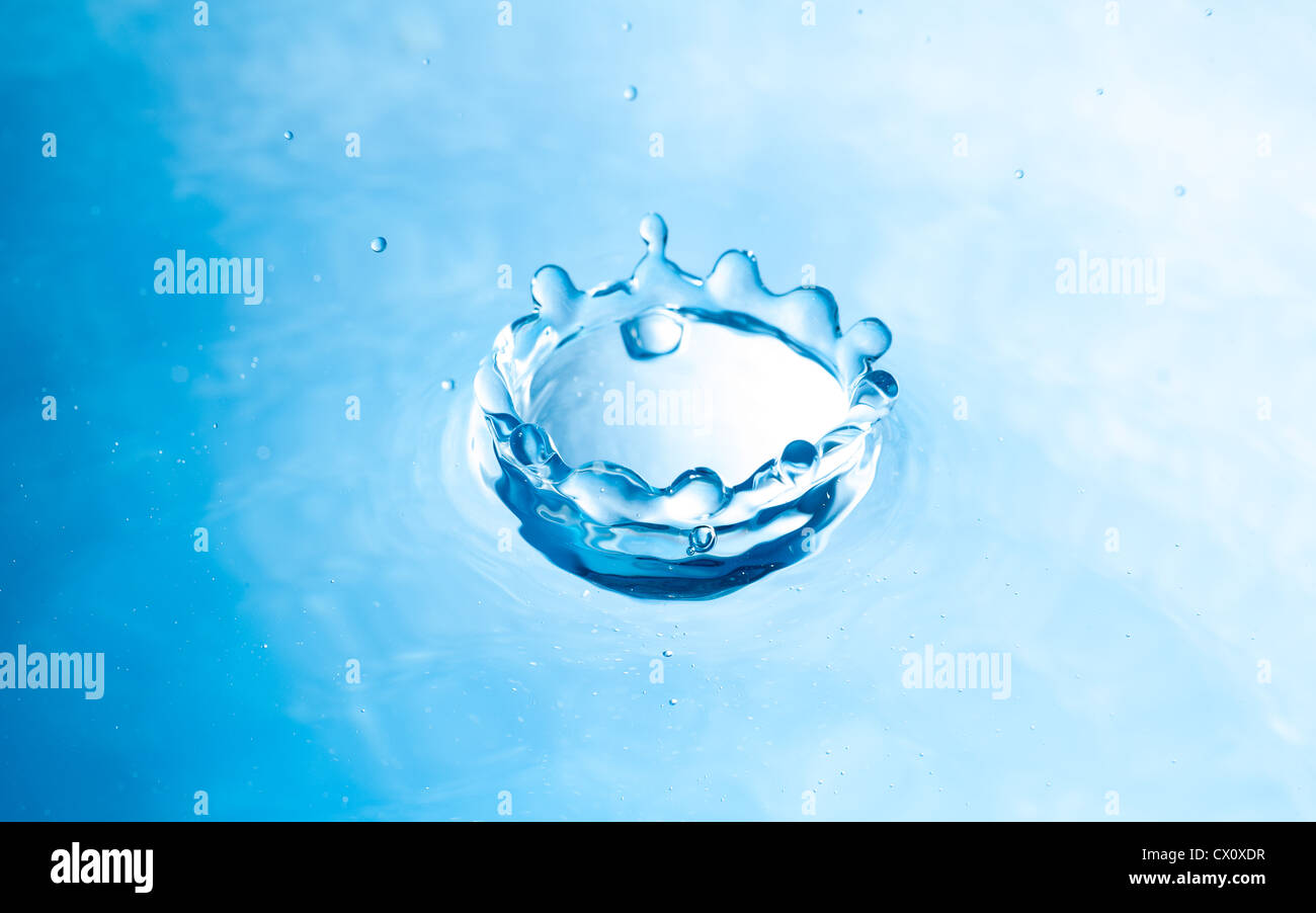 Shape of drop of water splash blue color Stock Photo - Alamy