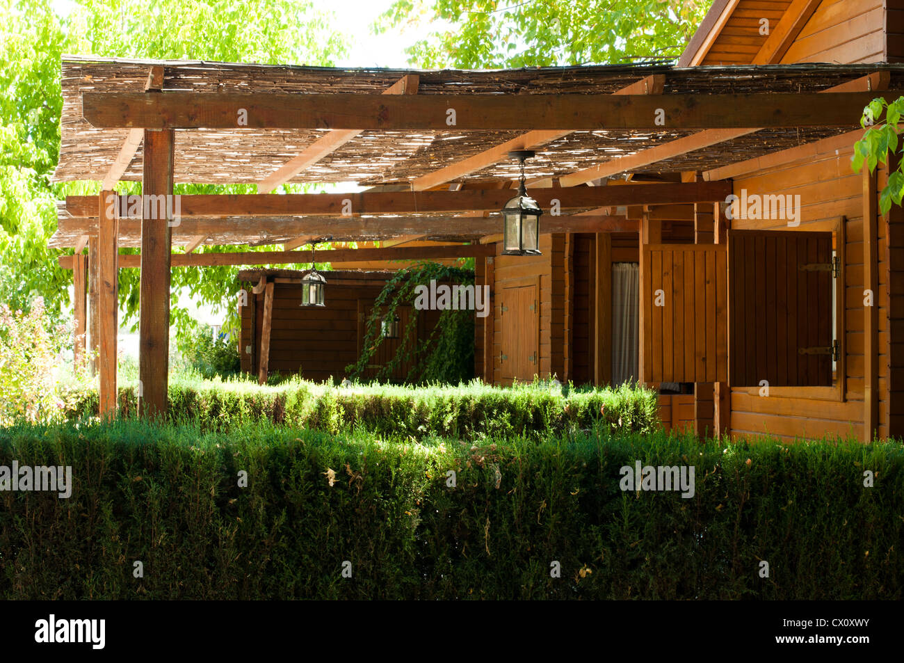Wooden bungalow and garden Stock Photo - Alamy