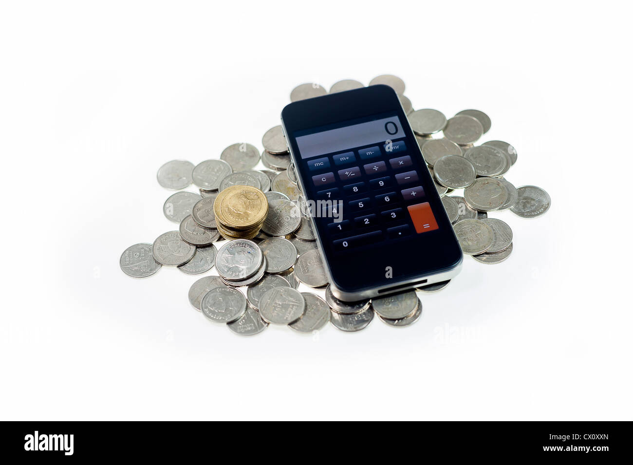Mobile phone with coins on white background Stock Photo - Alamy