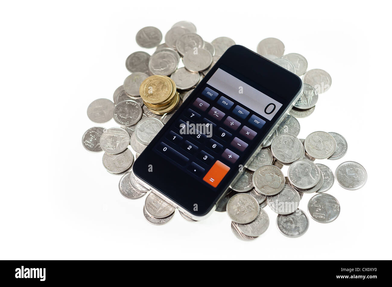 Mobile phone with coins on white background Stock Photo - Alamy