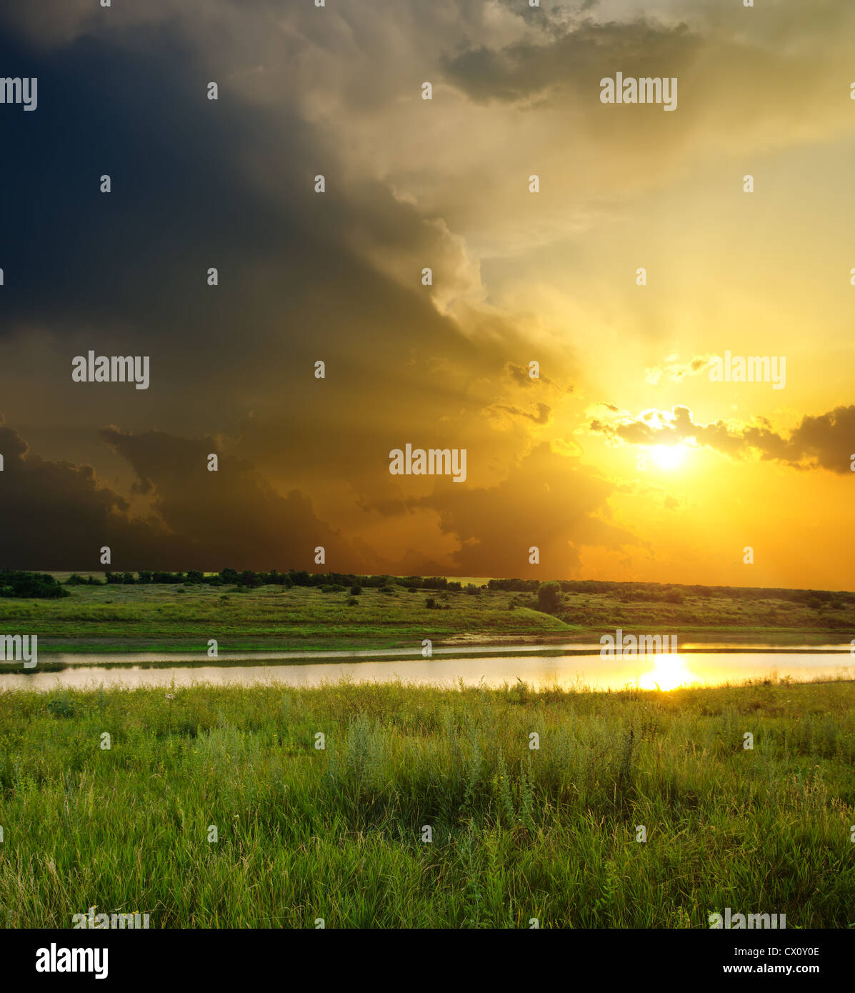 sunset over river Stock Photo - Alamy