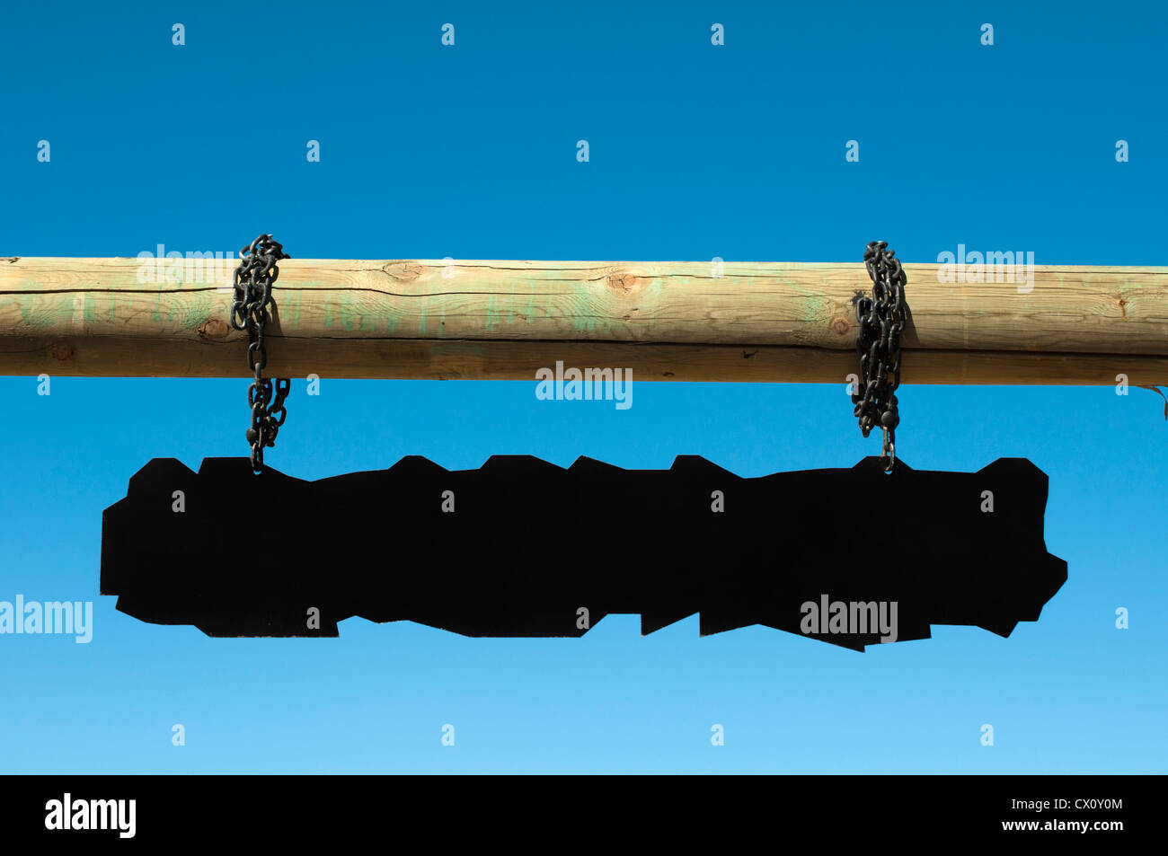 Signboard attached to tree. Horizontal black signboard Stock Photo - Alamy