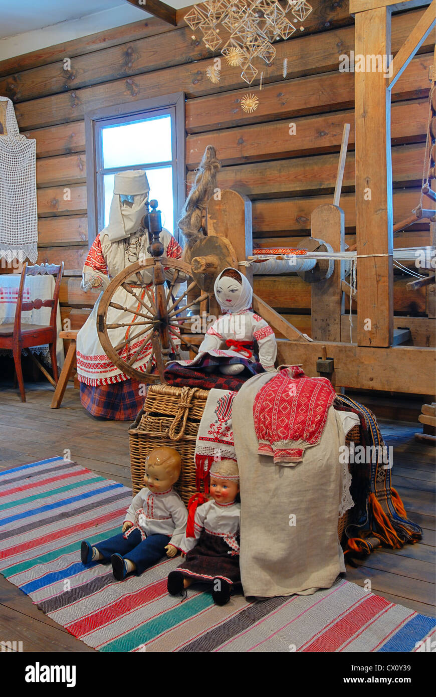 Elements of the old life - spinning wheel, antique clothing, woven ...
