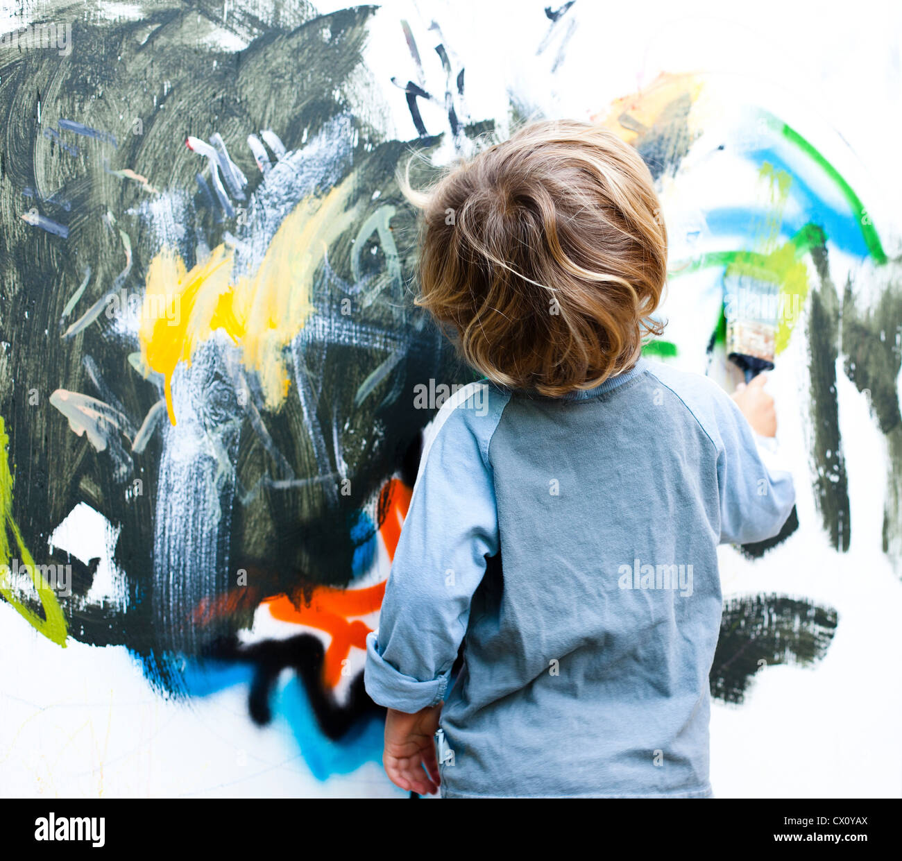 Little boy painting Stock Photo - Alamy