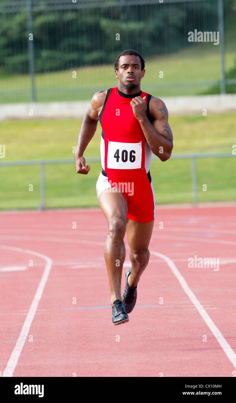 Male athlete running on track Stock Photo - Alamy