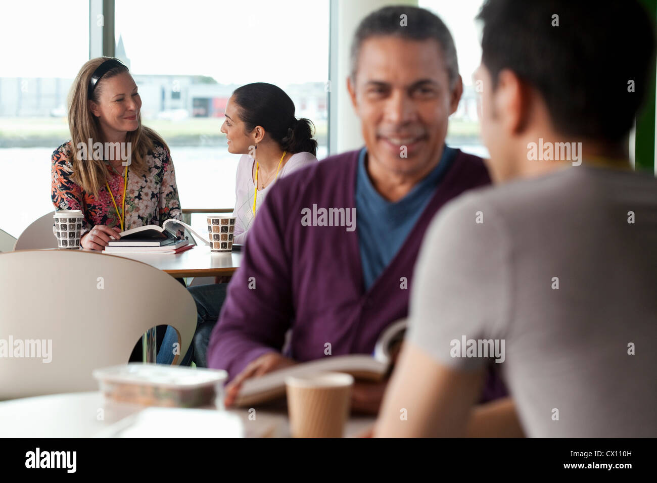 People having conversation in cafe Stock Photo - Alamy
