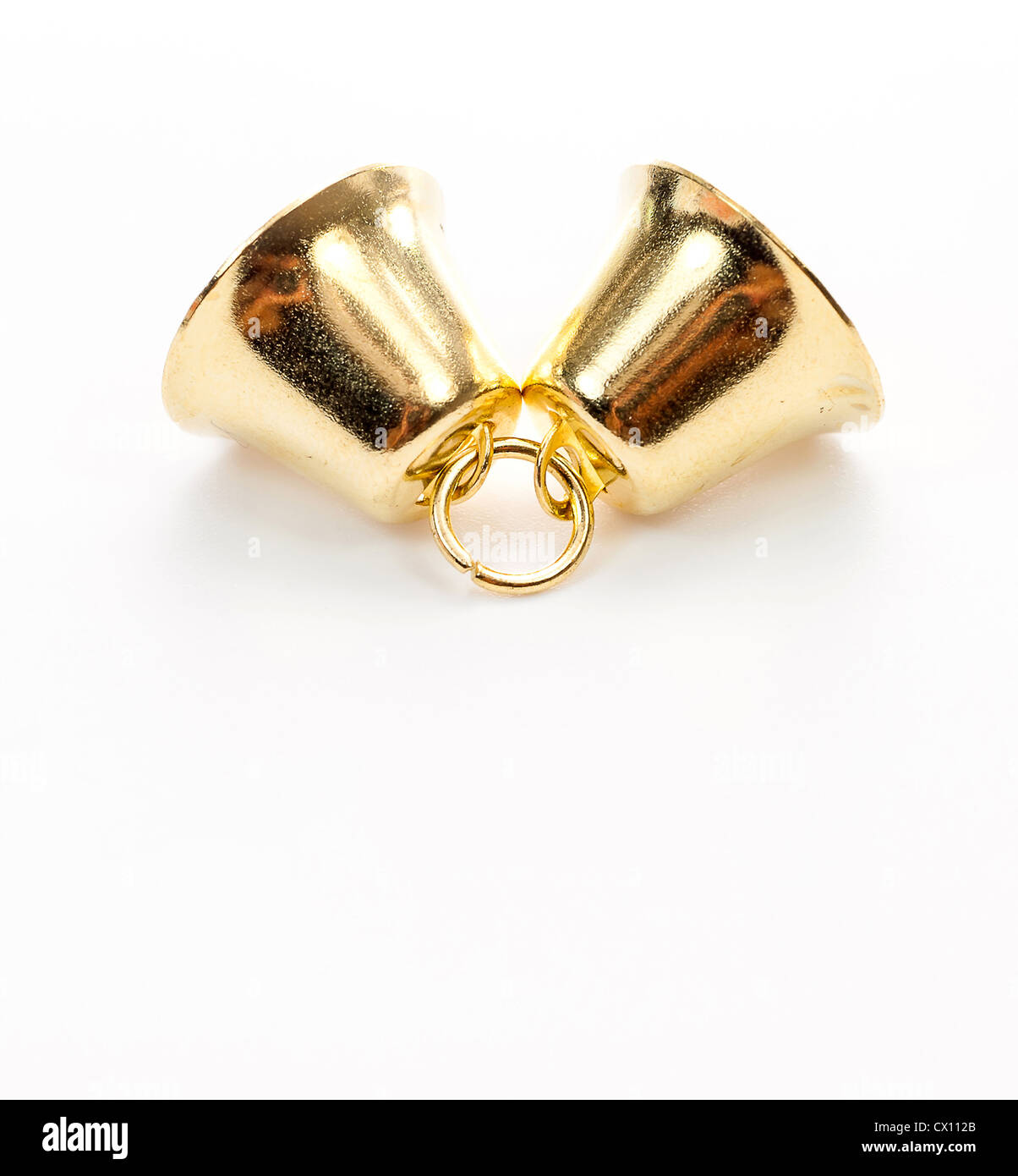 Golden bell isolate on white background Stock Photo - Alamy