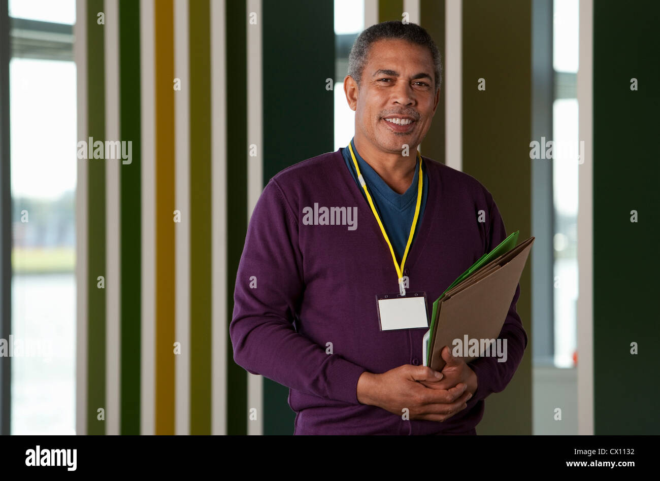 Man holding files, portrait Stock Photo - Alamy
