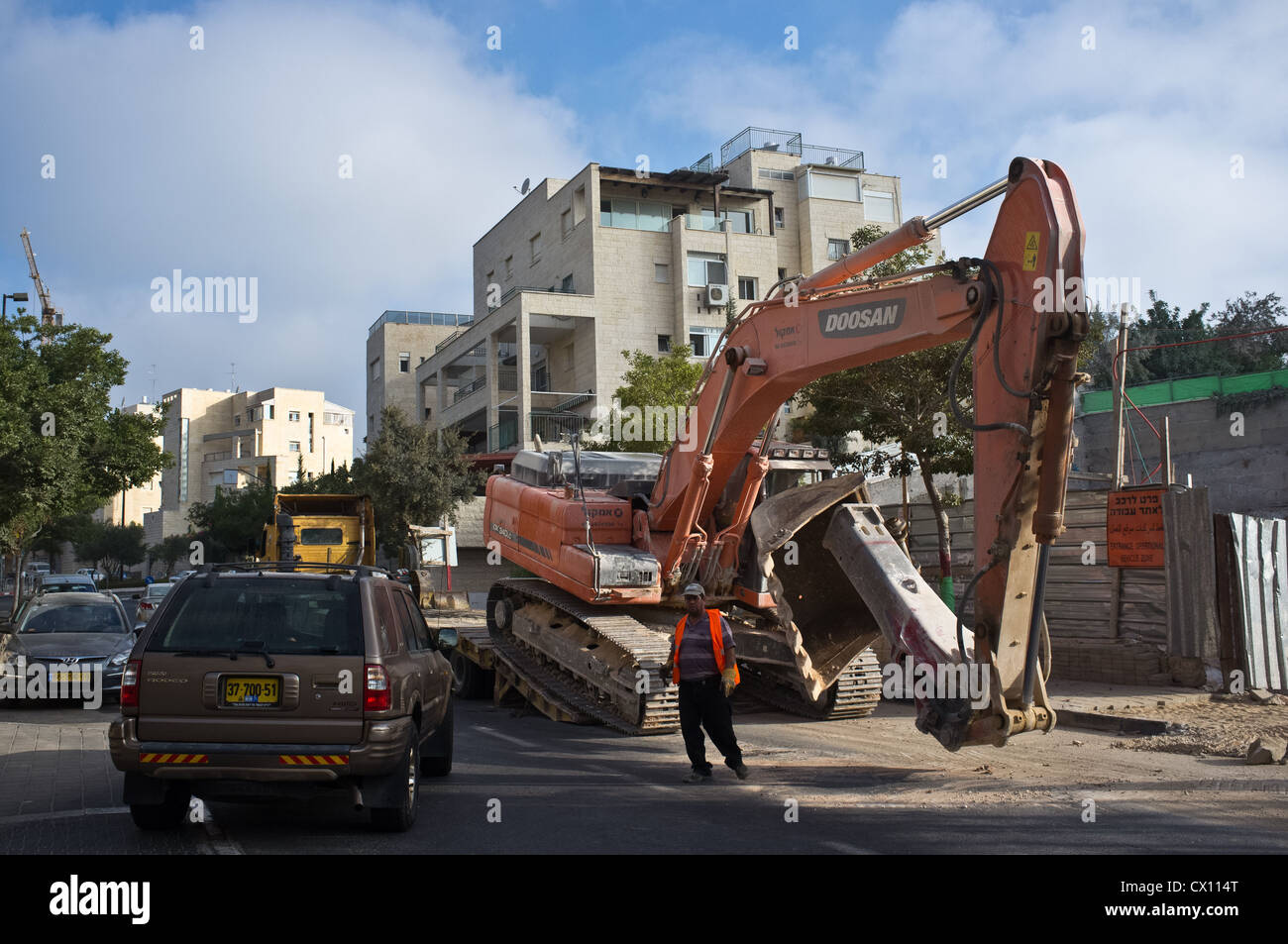 A Doosan DX340LC Hydraulic Excavator is loaded aboard a transport ...