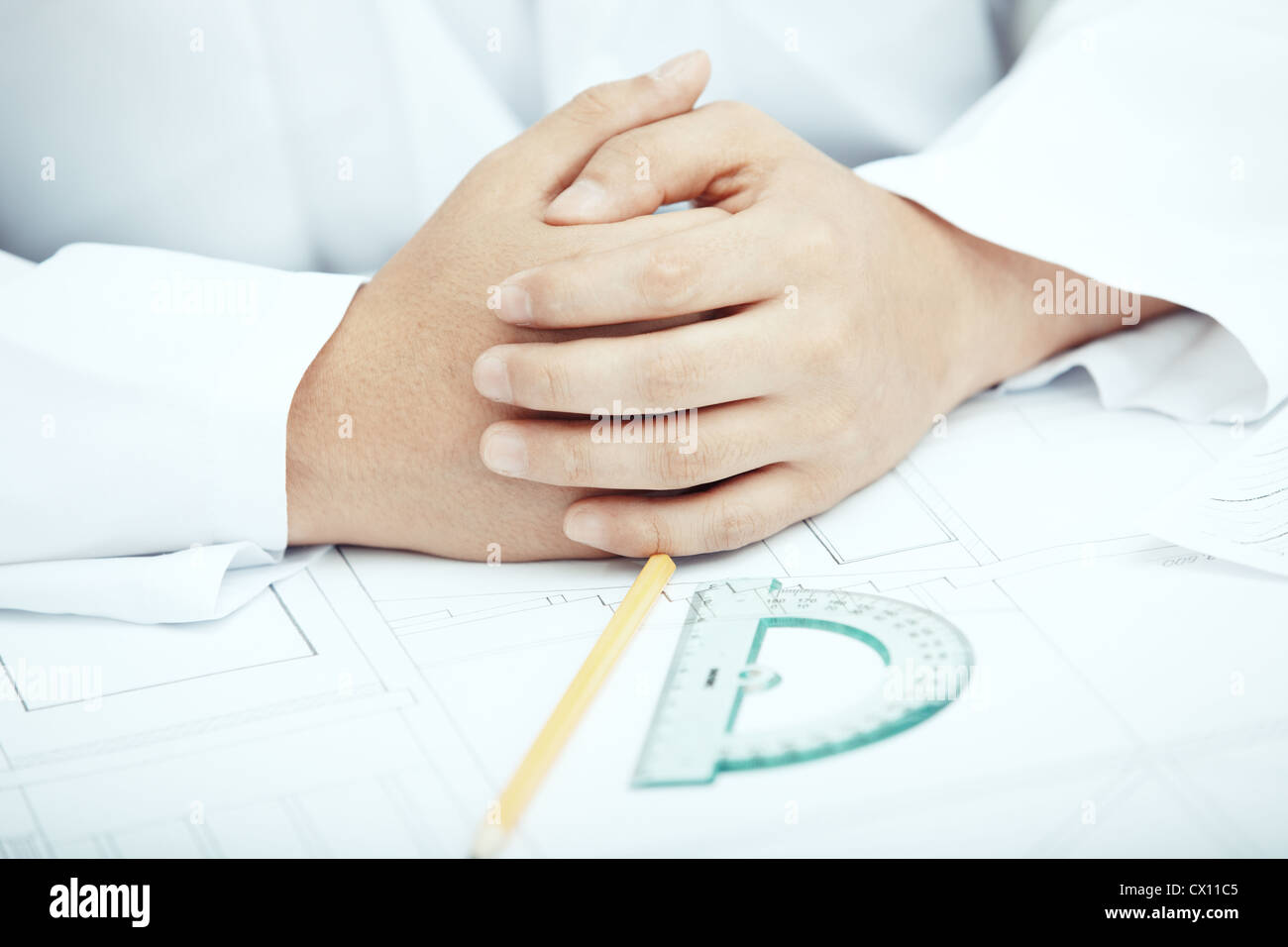 Hands of engineer working with drawing project Stock Photo - Alamy