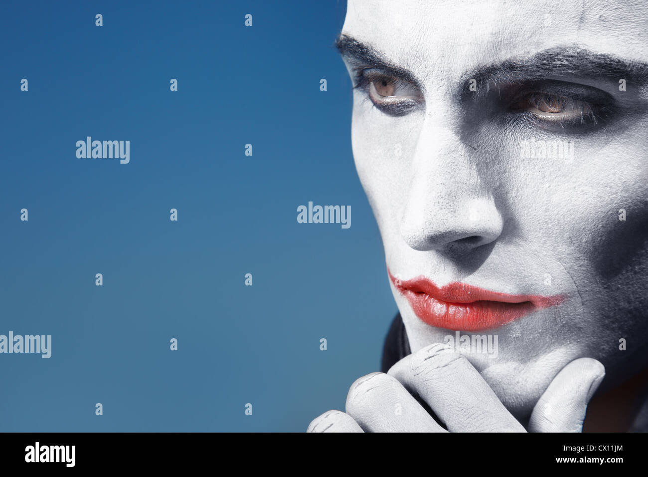 Alone clown thinking outdoors. Horizontal photo. Artistic darkness and ...