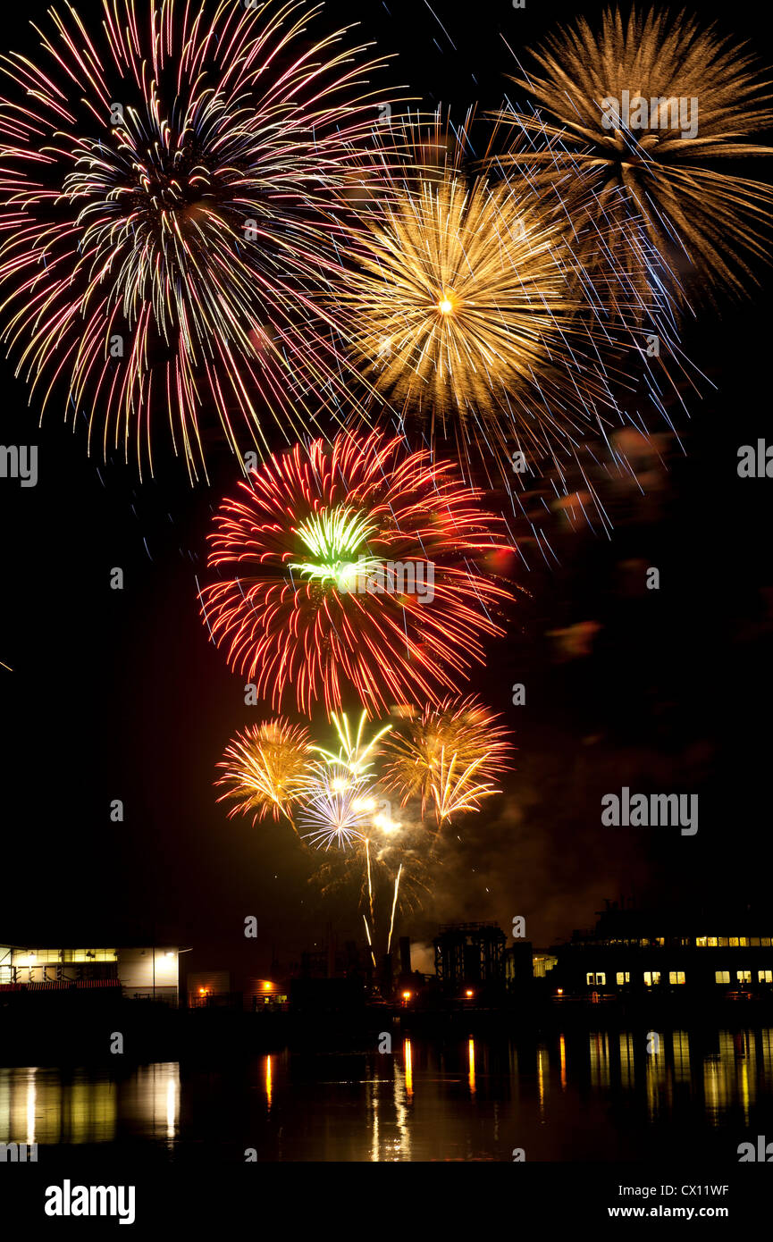 Firework display over water Stock Photo - Alamy