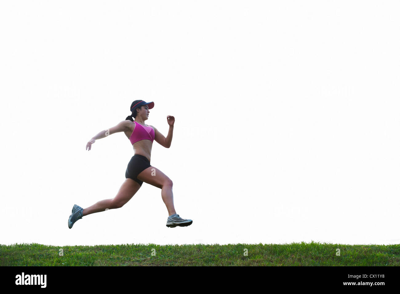 Young woman running Stock Photo - Alamy