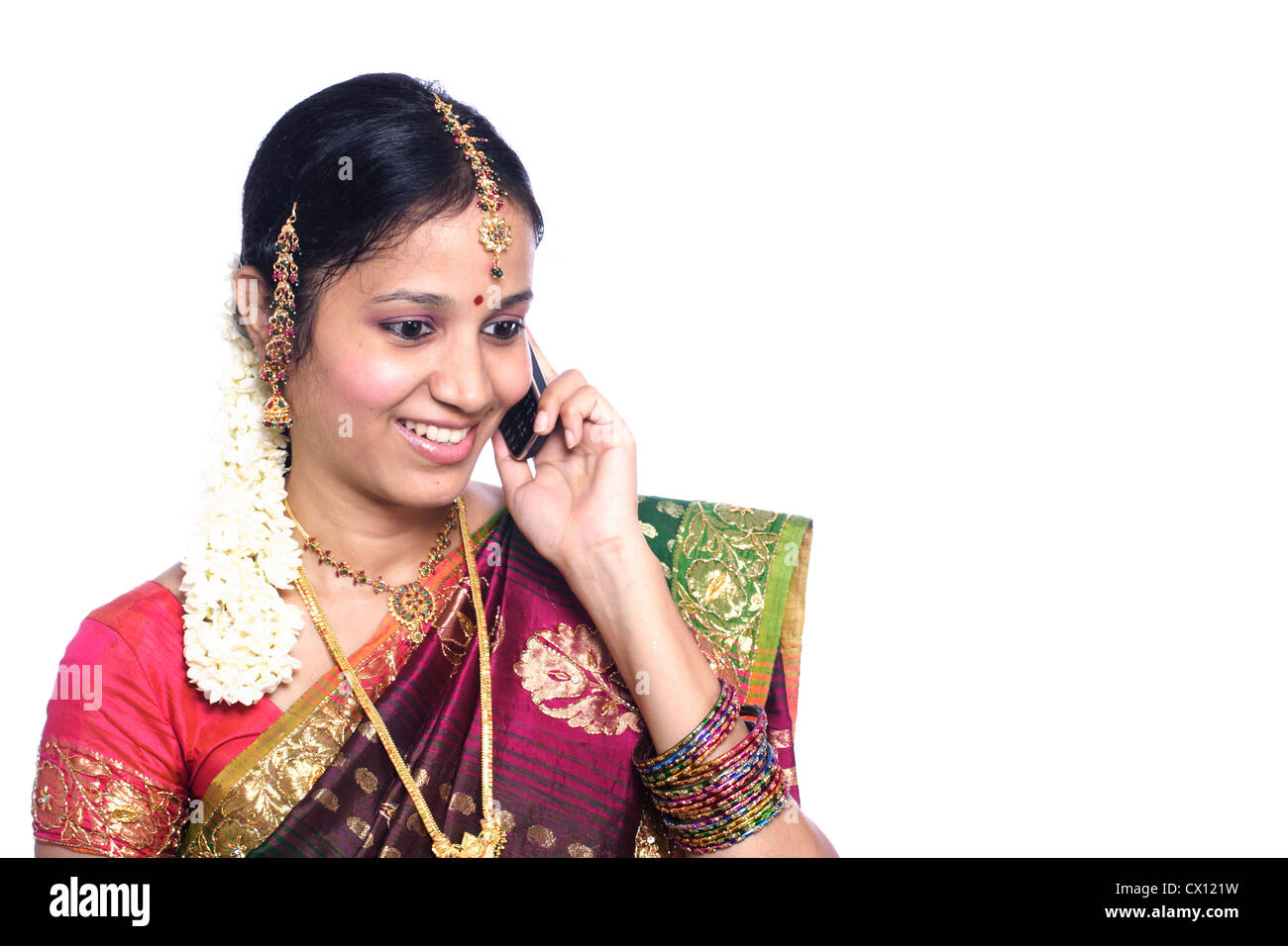 Youn Indian traditional woman talking on cellphone Stock Photo - Alamy