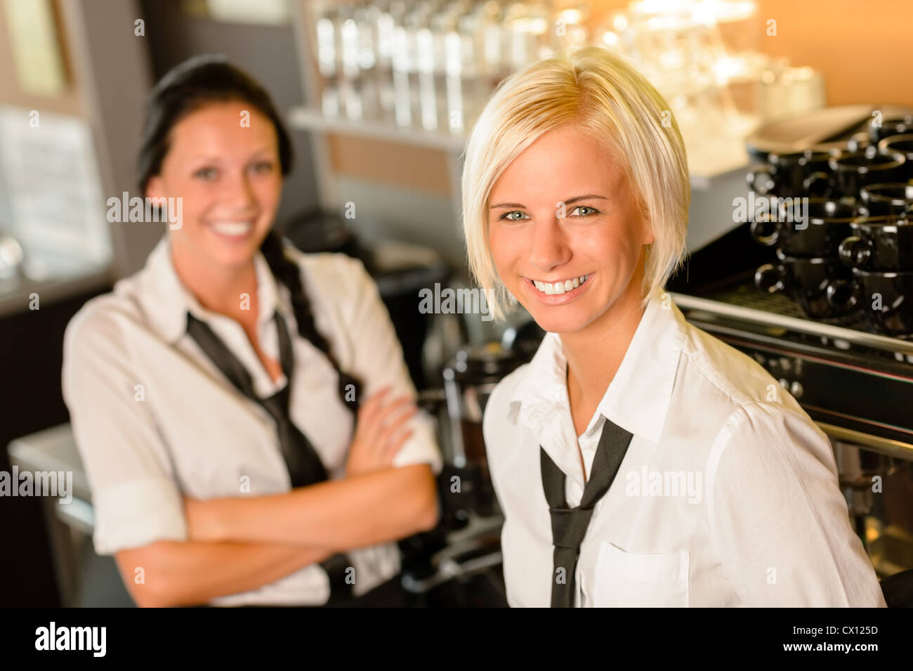 Cafe waitresses behind bar smiling at work break women colleagues Stock ...