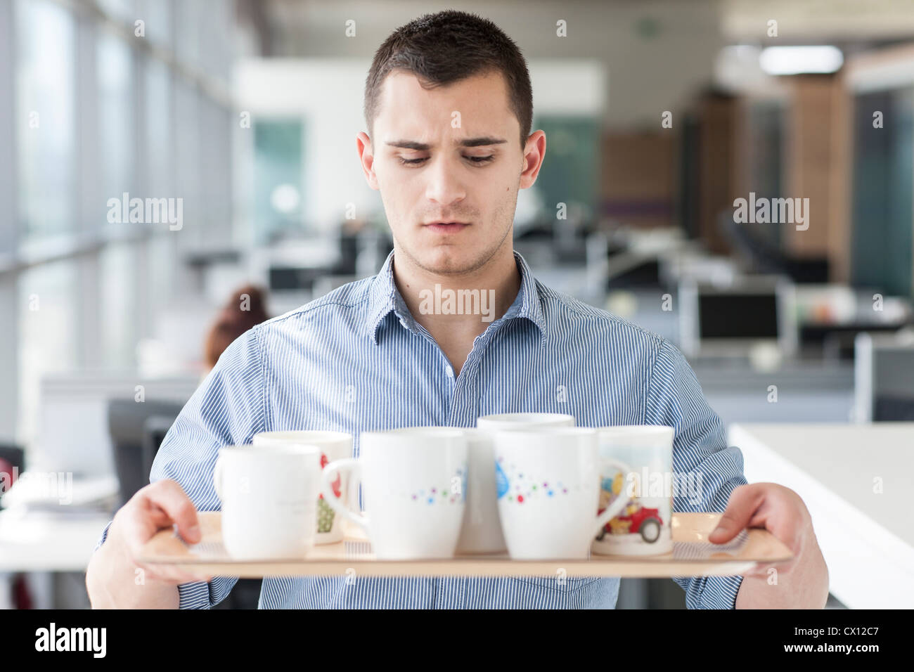 Carrying tea and coffee mugs hi-res stock photography and images - Alamy