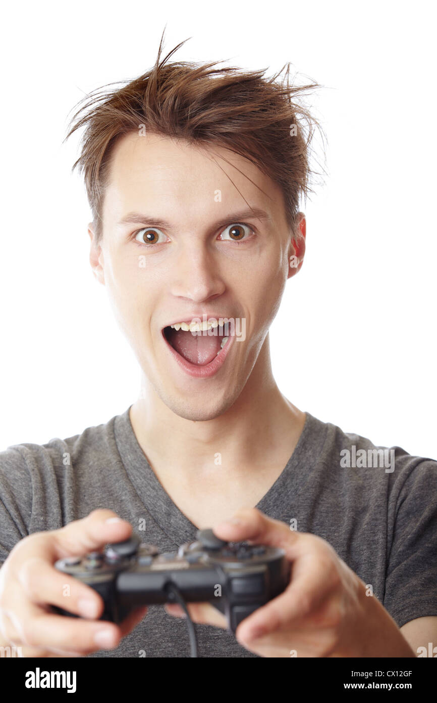 Laughing man plays computer game using joystick Stock Photo - Alamy